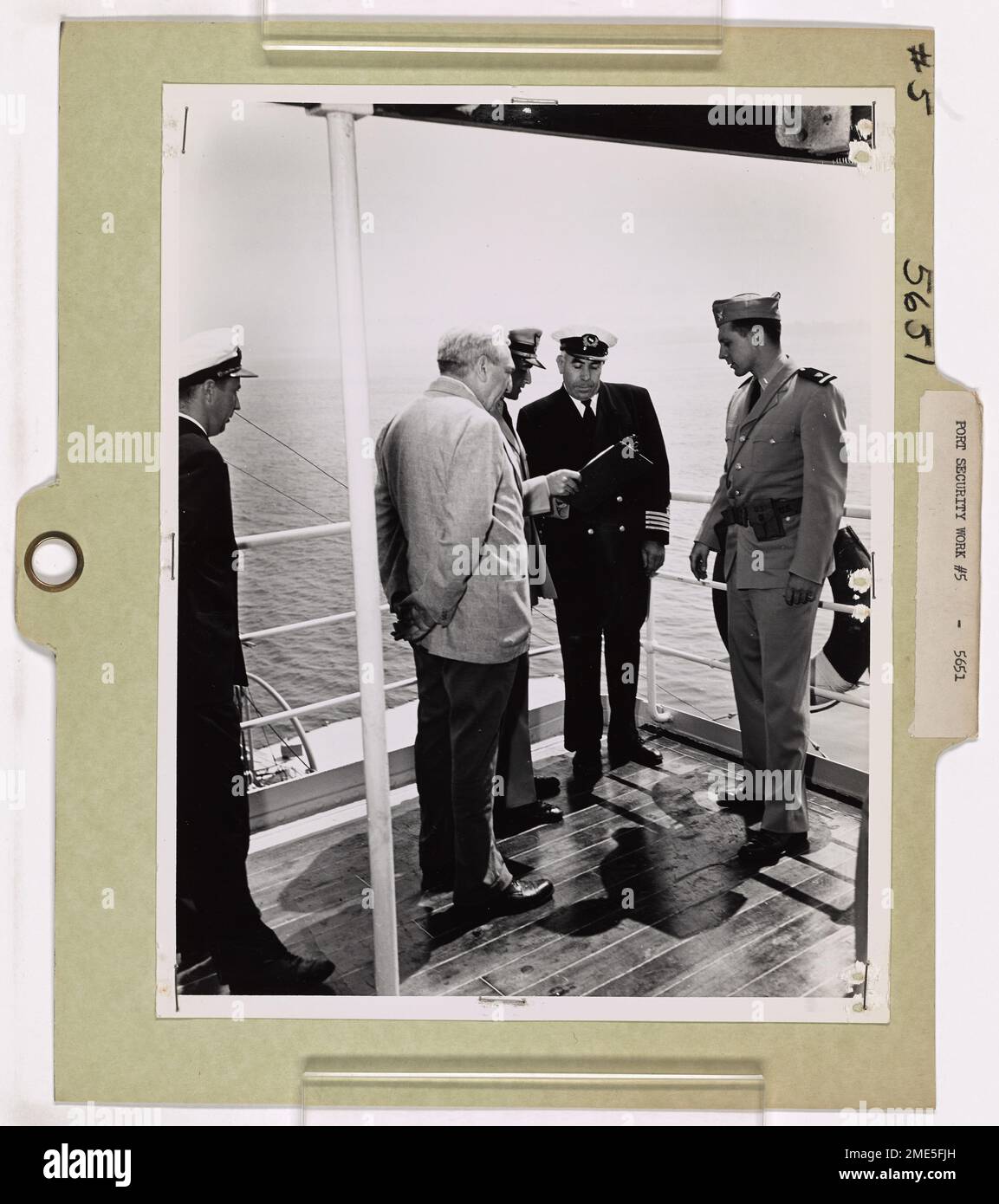 Coast Guardsmen aboard a foreign vessel in Gravesend Bay converse with ...