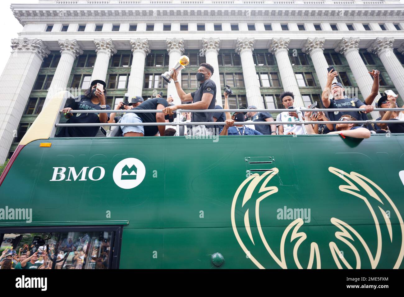Milwaukee Bucks' Giannis Antetokounmpo holds up the MVP NBA trophy ...