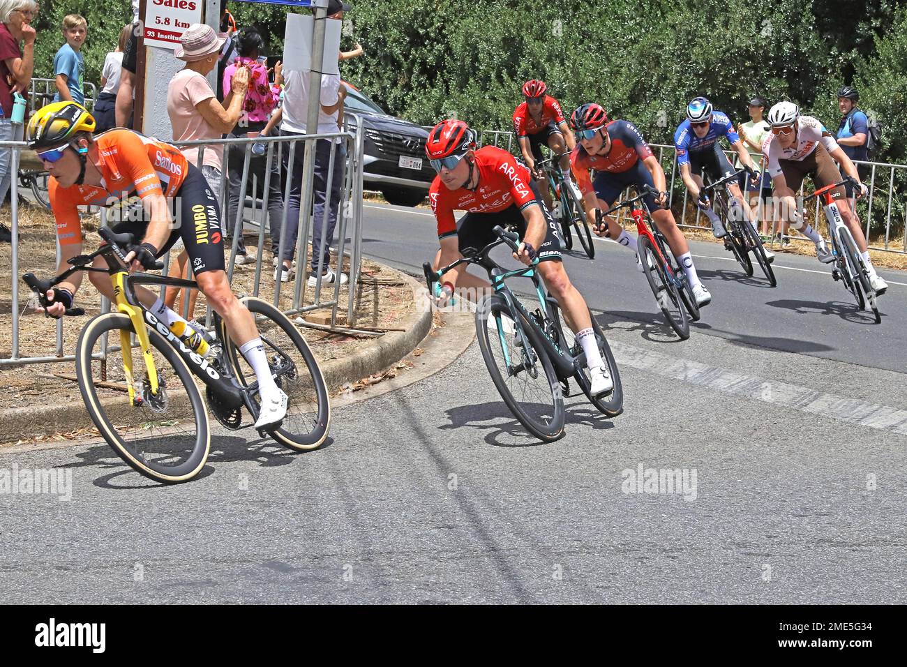 Riders negotiating the final turn prior to the finish line in stage 3 ...