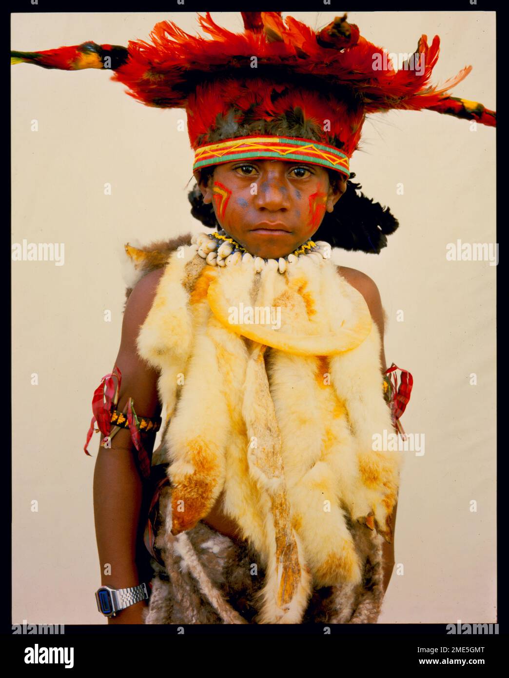 Six year old Chimbu lad Simon in traditional dress and wearing cus-cus ...