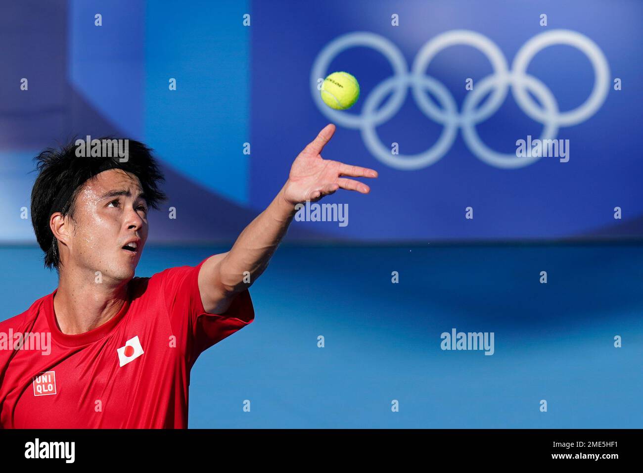 Taro Daniel, of Japan, practices for the men's tennis competition at ...