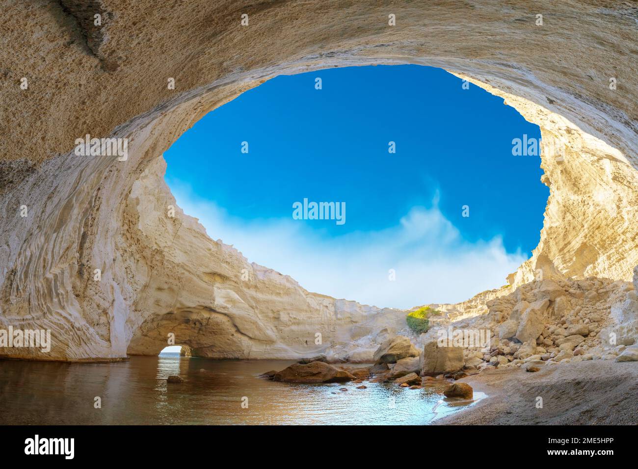 View of the volcanic open cave of Sykia, Milos island, Cyclades, Greece ...