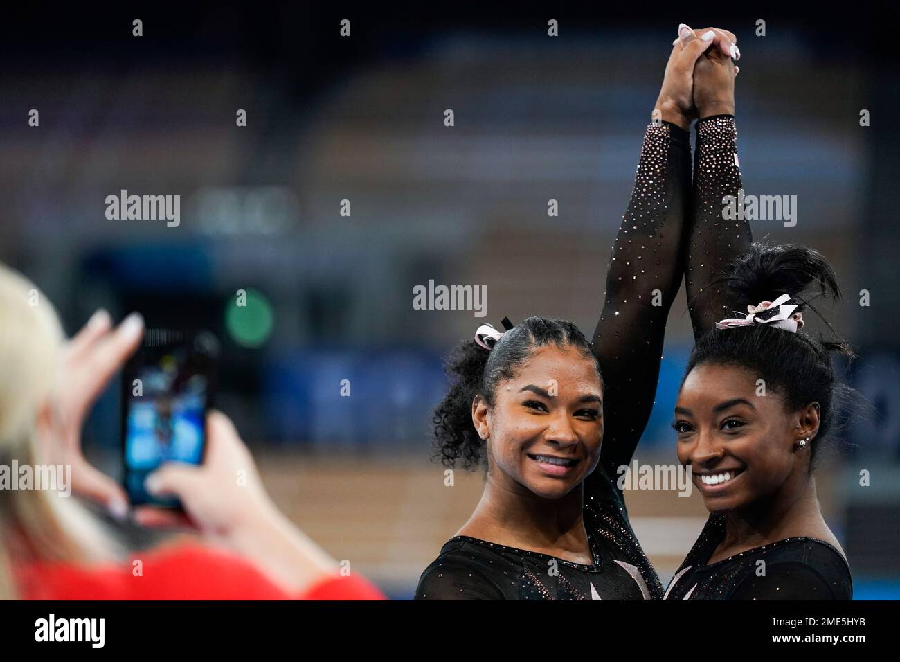 Jordan Chiles, center, and Simone Biles, right, of the United States ...