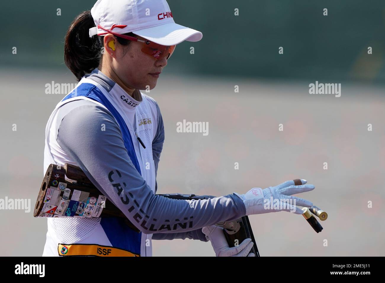 Meng Wei, of China, tosses her shells as she practices at the Asaka ...