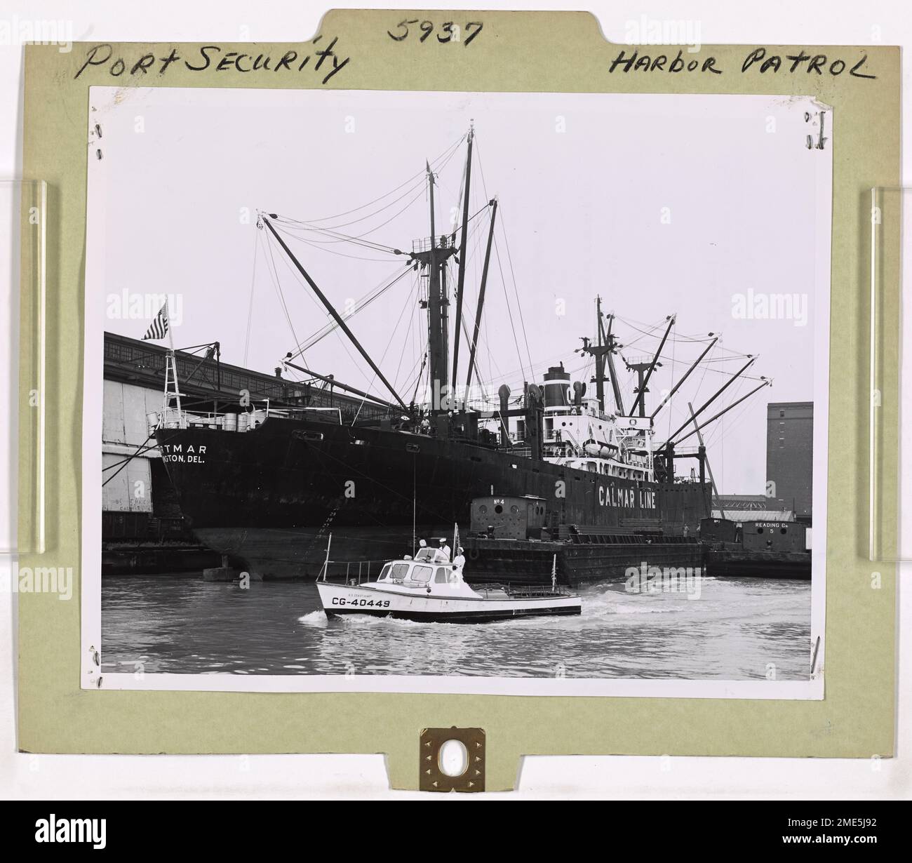 A Coast Guard vessel inspects the moorings of an oil tanker at the Port ...