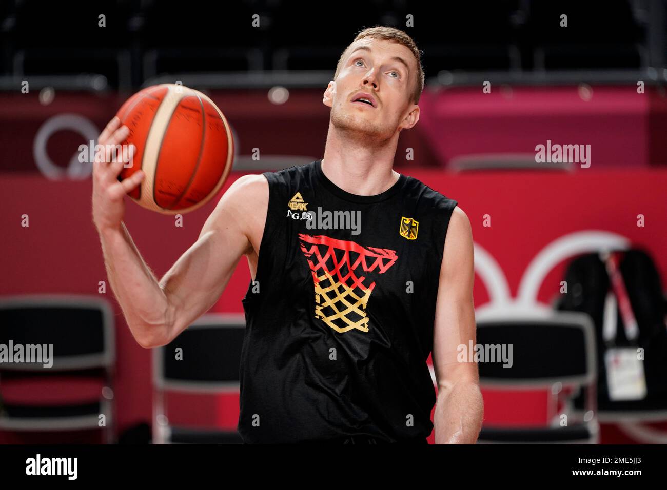 Germany's Niels Giffey walks on the court during a men's basketball ...