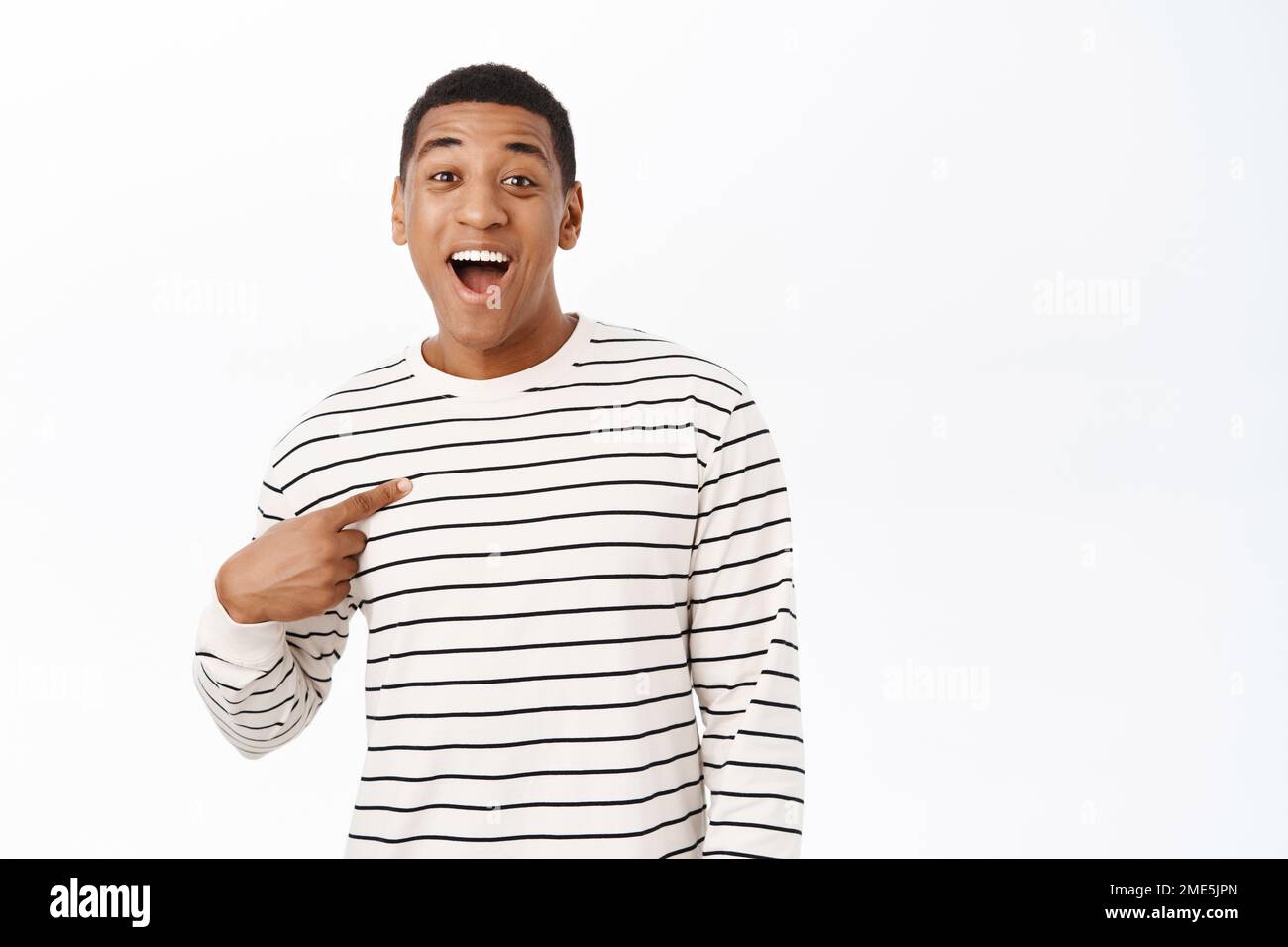 Image of smiling african american guy pointing at himself, self ...