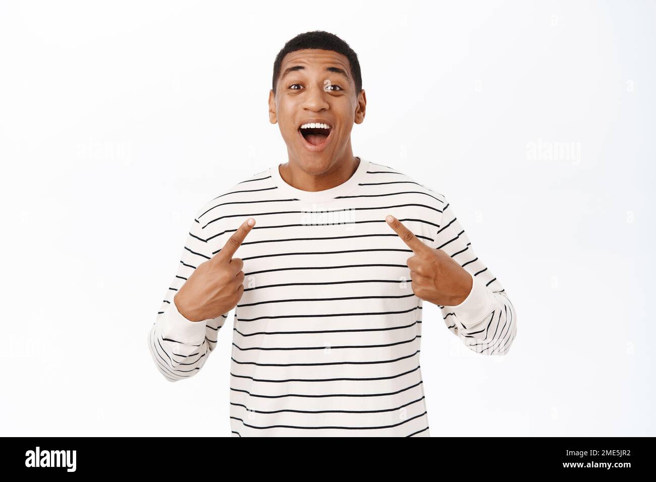 Image of smiling african american guy pointing at himself, self ...