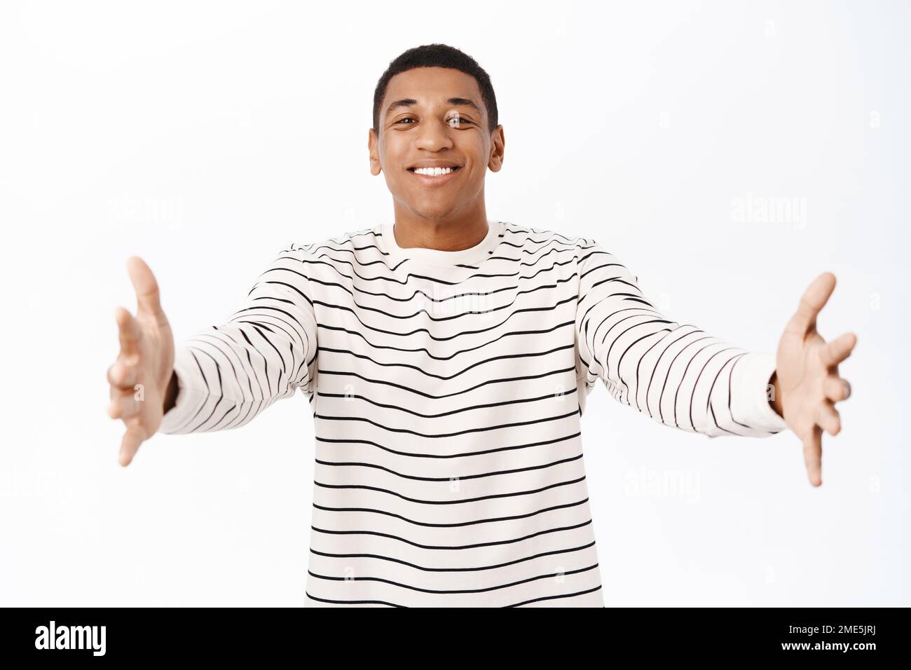 Happy smiling african american man reaching for hug, stretching out ...