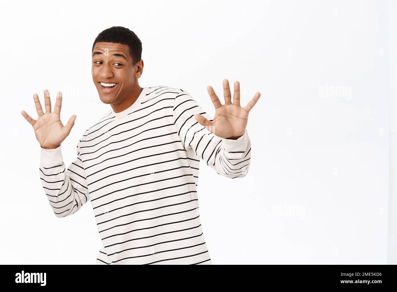 Image of smiling man demonstrate smth, raising palms up and showing ...