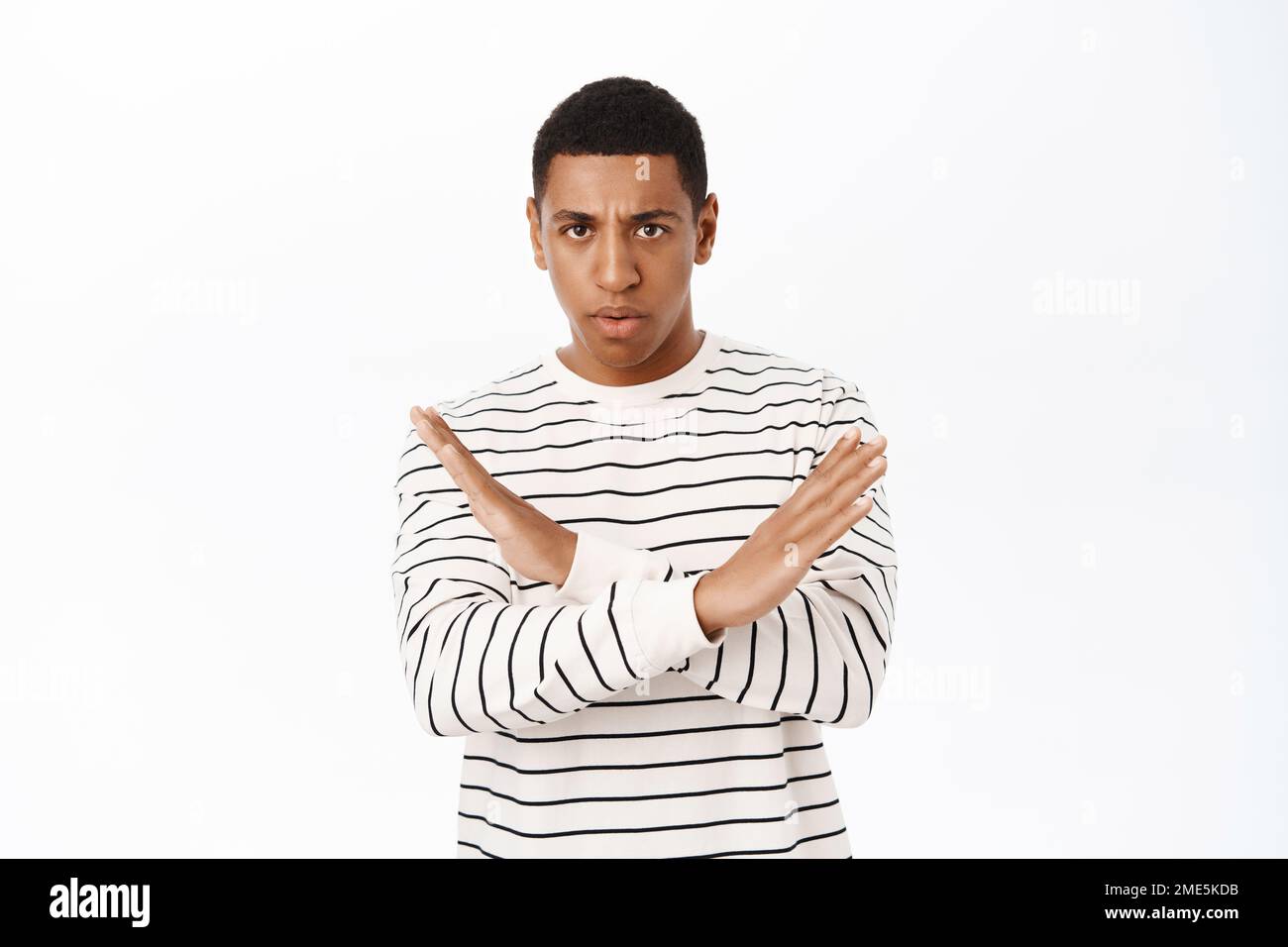 Worried Black man shows stop, reject gesture, prohibit smth, looking ...