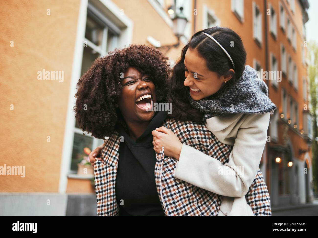 Friends laugh, comedy on adventure and travel in city, happy people ...