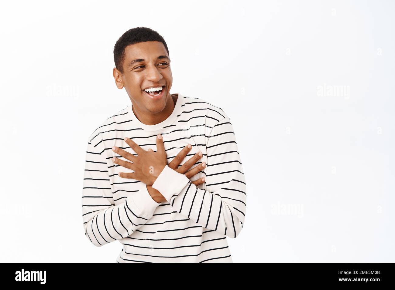 Portrait of african american man laughing and smiling, looking with joy ...