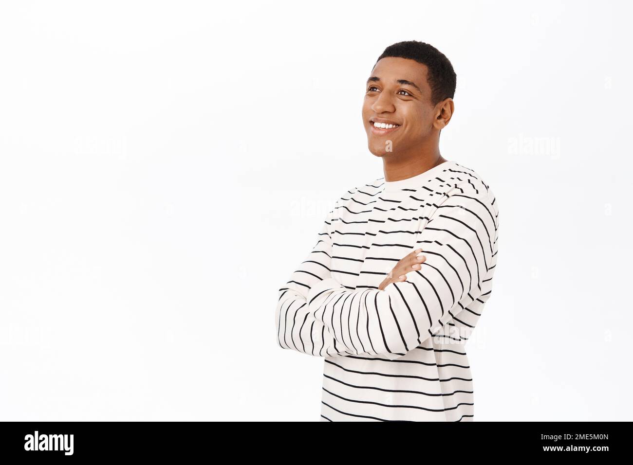 Handsome smiling Black man in power pose, looking professional, cross ...