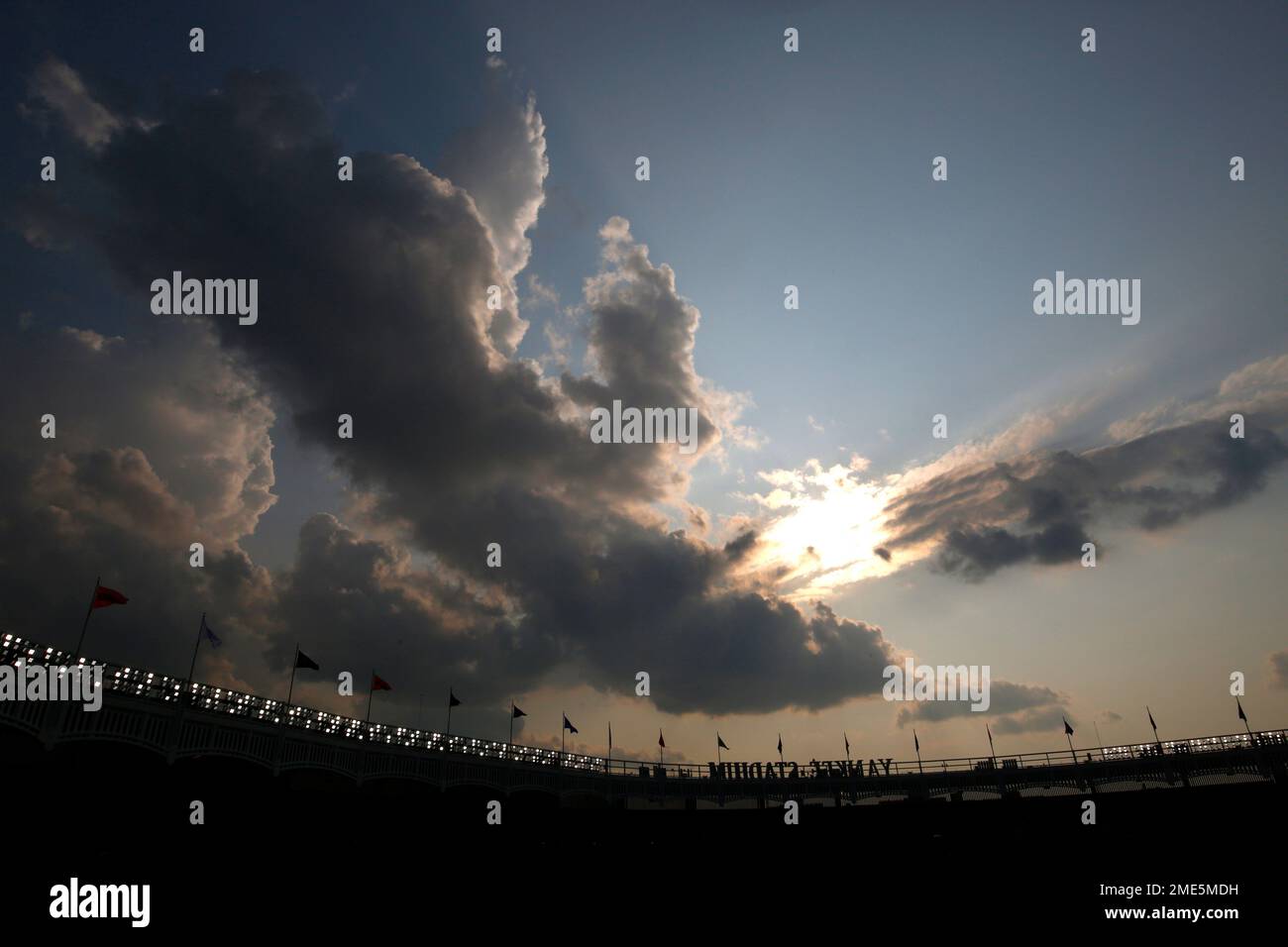 A clearing sky appears over Yankee Stadium after a rain storm moved ...