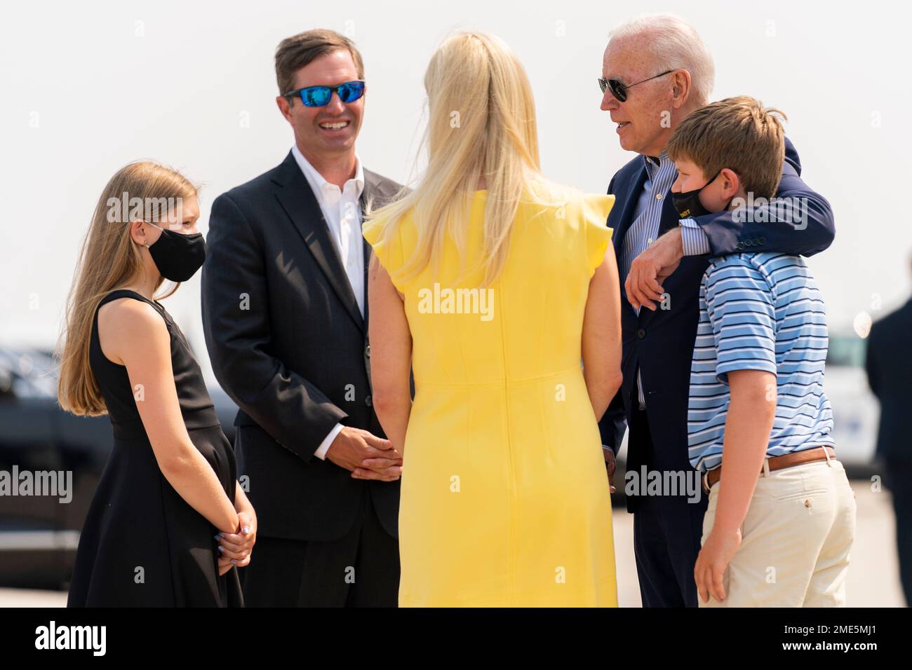 President Joe Biden is greeted by Kentucky Gov. Andy Beshear, second ...