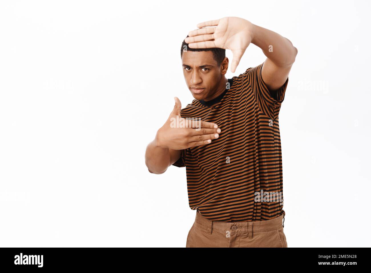 Image of enthusiastic african american man taking picture, capture ...