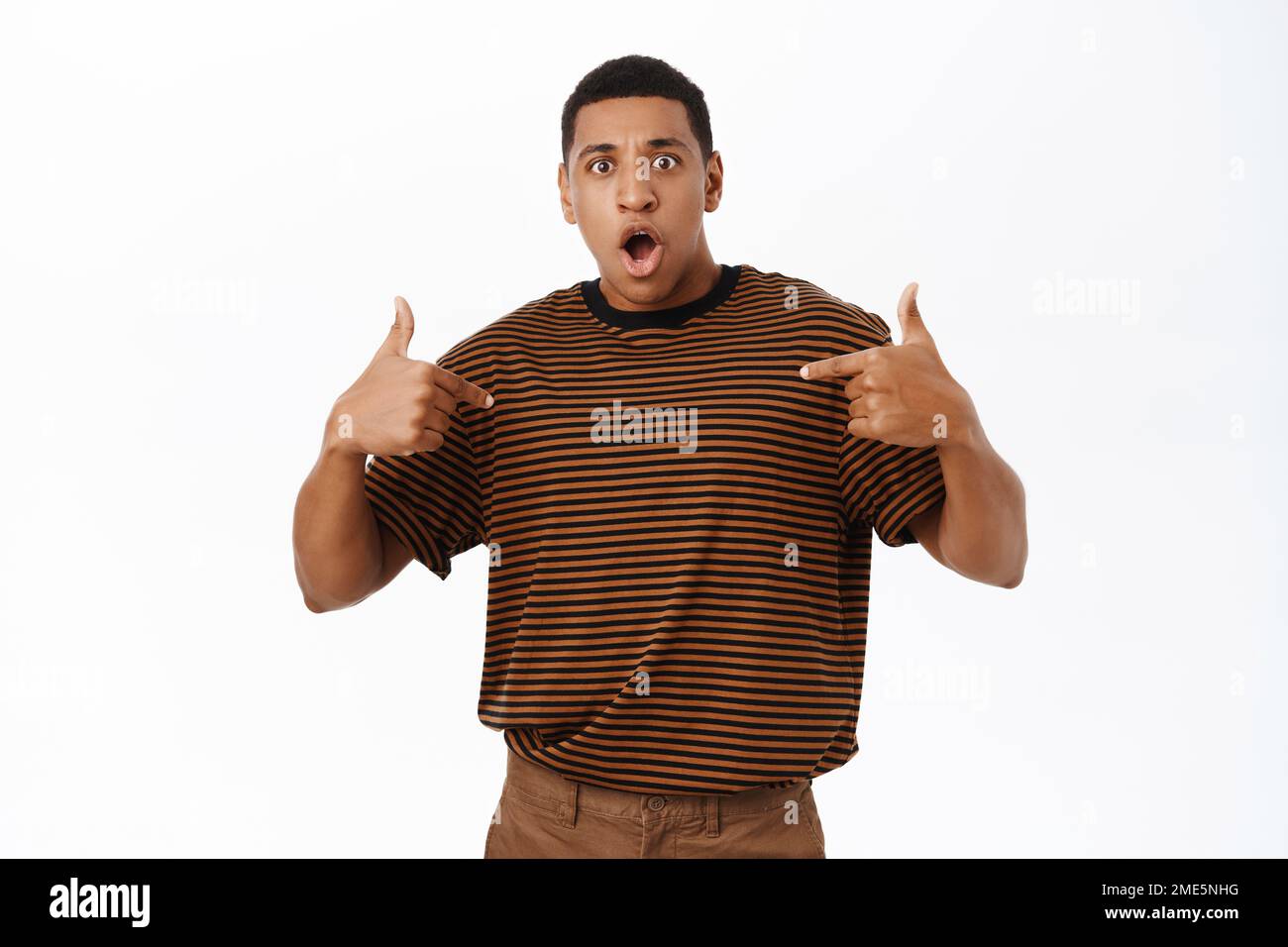African american man pointing at himself, standing in casual clothes ...
