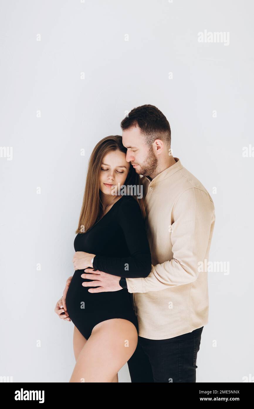 man and a pregnant woman waiting for a child hug at home Stock Photo ...