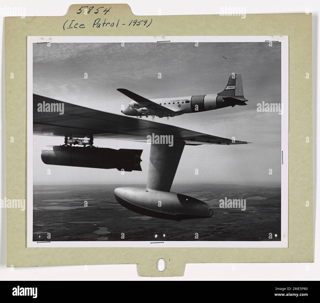 A Coast Guard UF-2G amphibian plane carries a 1,000-pound thermate bomb ...