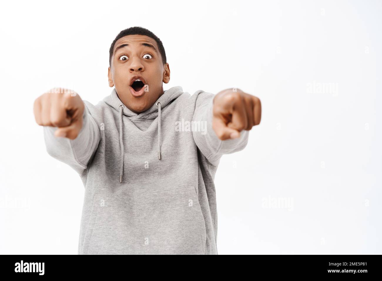 Excited smiling African american man pointing fingers at you ...