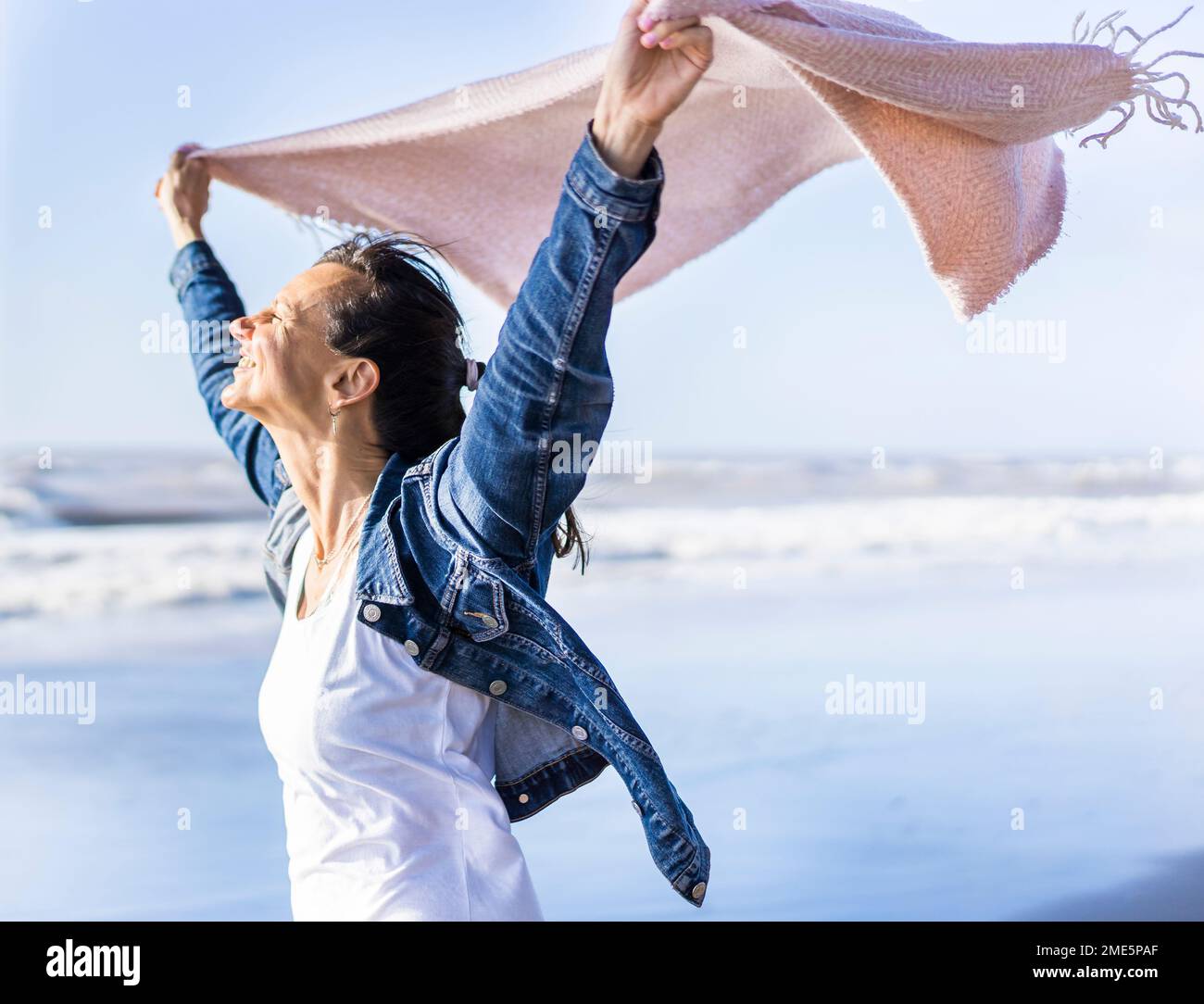 Happy woman holding a scarf on the wind. Freedom concept Stock Photo ...