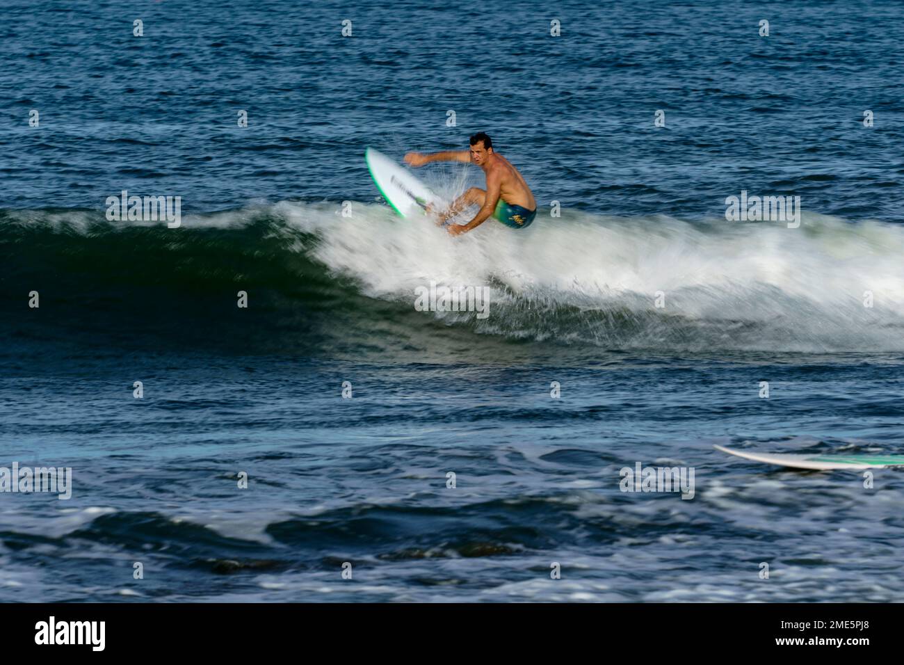 Surfer Julian Wilson, of Australia, rides a wave during a practice ...