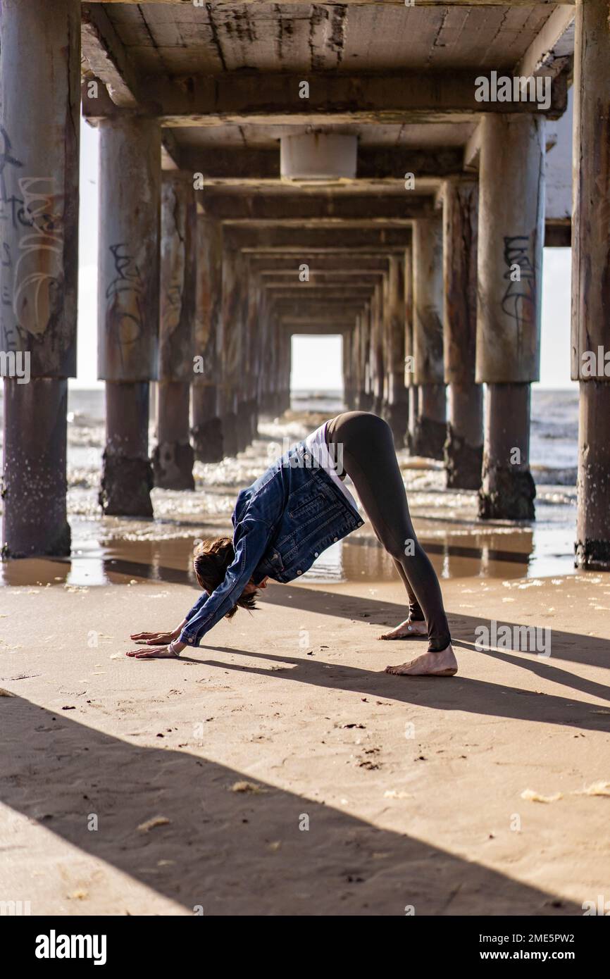 Attractive muscular woman doing stretching hi-res stock photography and ...