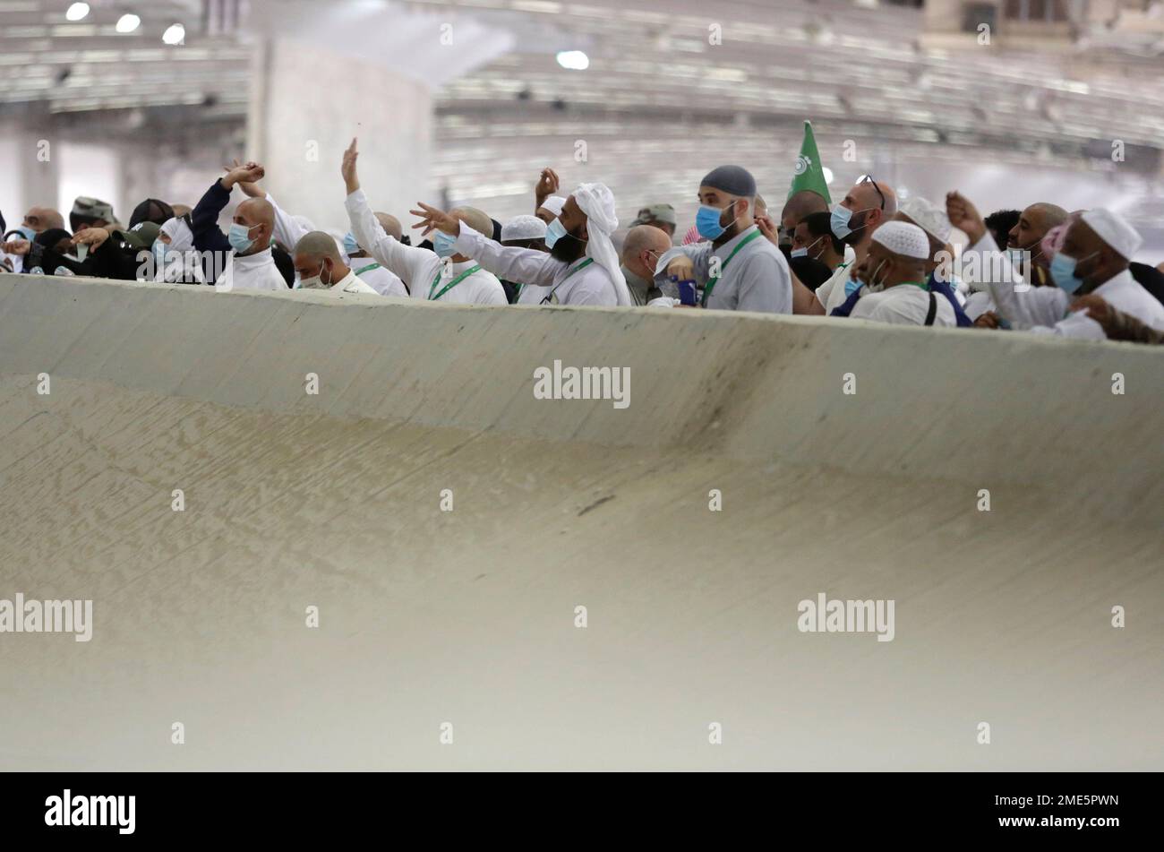 Muslim pilgrims cast stones during the symbolic stoning of the devil ...