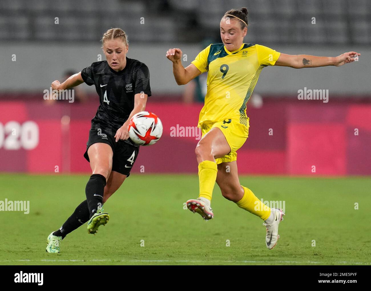 New Zealand's CJ Bott, left, and Australia's Caitlin Foord battle for ...