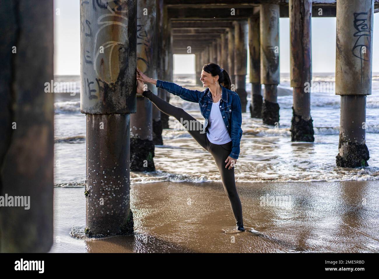 Woman exercises beach water hi-res stock photography and images - Alamy