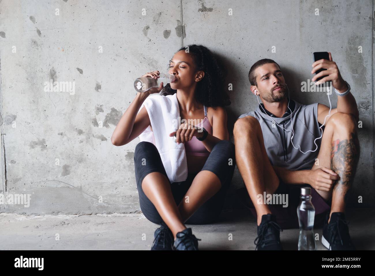 Time to rest up before the next challenge. a sporty young couple ...