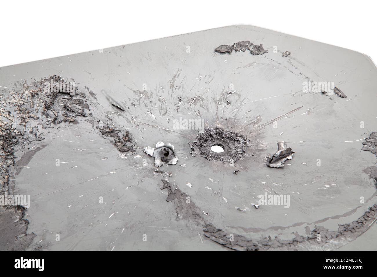 The metal plate of the bulletproof vest pierced by a bullet. Isolate on ...