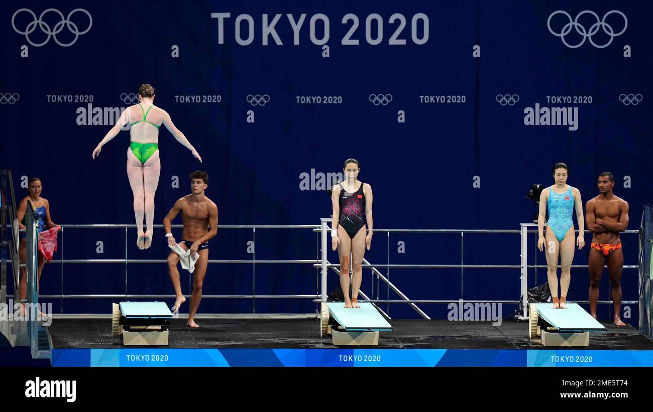 Athletes exercise during a diving training session at the Tokyo ...
