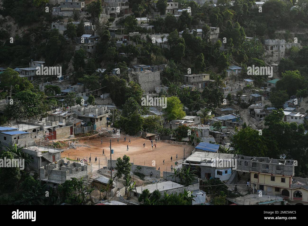 Children play soccer on a dirt court in the Bourdon neighborhood of ...