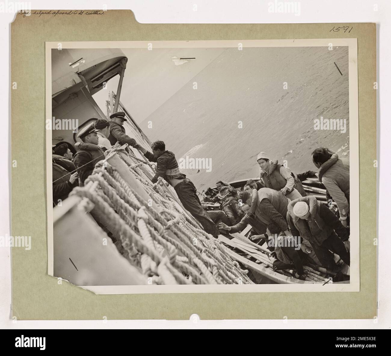 This image shows German sailors being taken aboard a Coast Guard cutter ...