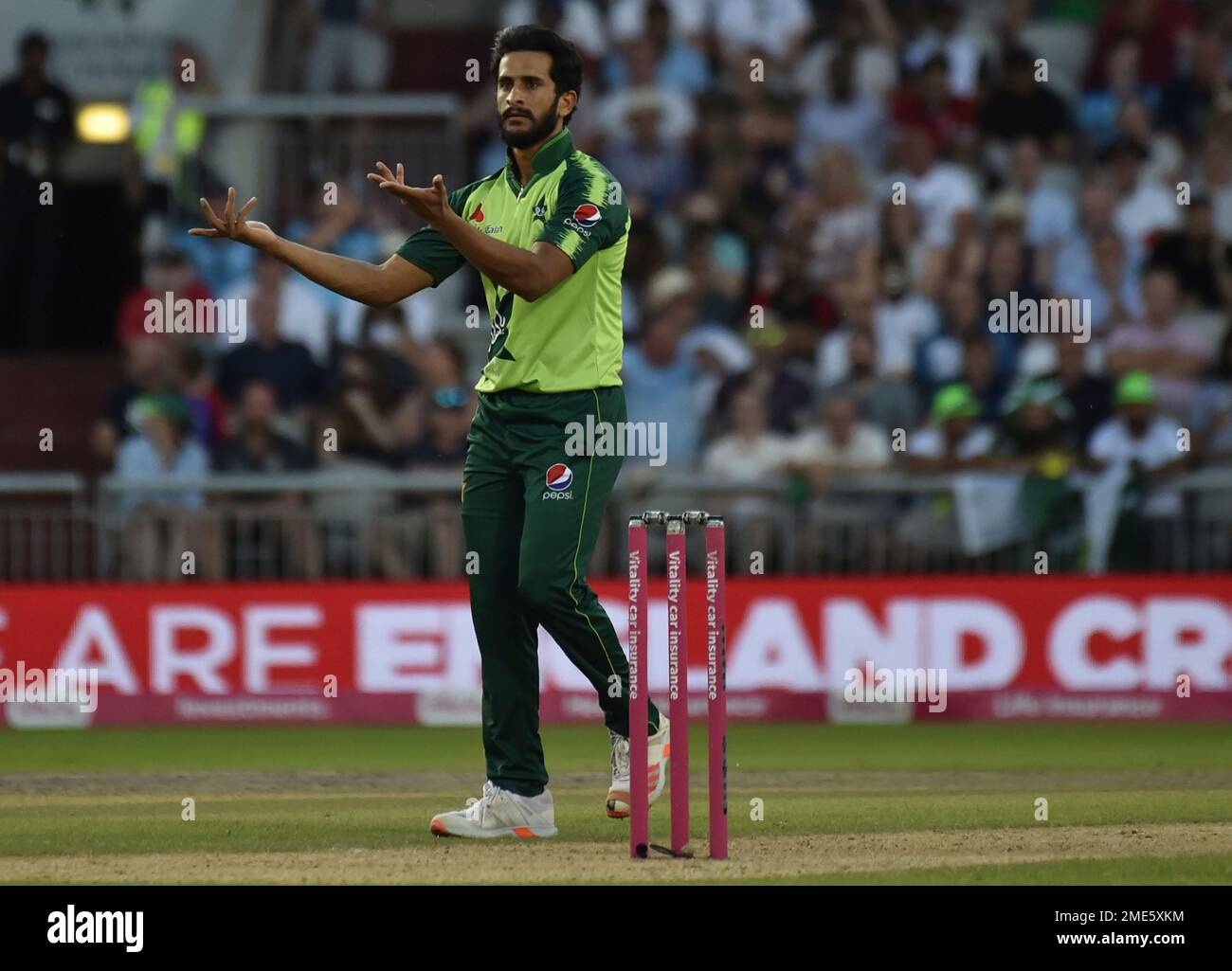 Pakistan's Hasan Ali reacts after bowling a delivery during the third ...