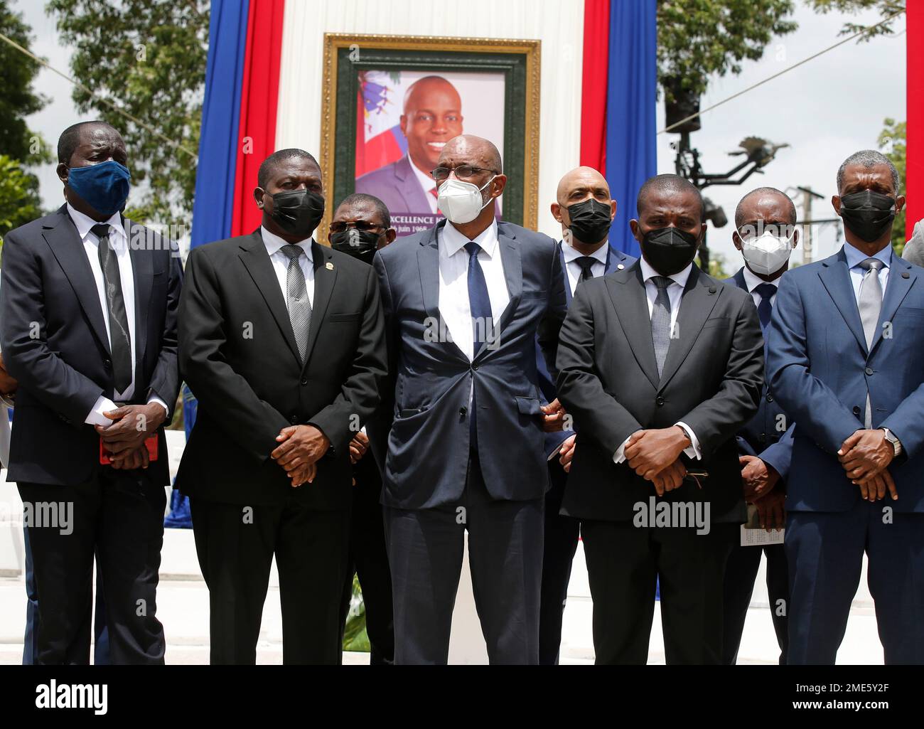 Haiti's designated Prime Minister Ariel Henry, center, and interim Prime Minister Claude Joseph ...