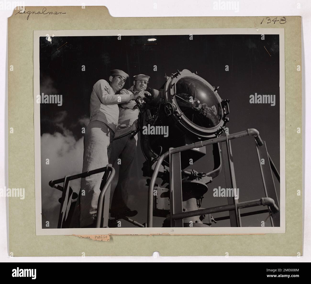 Signalmen of the U.S. Coast Guard work to communicate with other ...