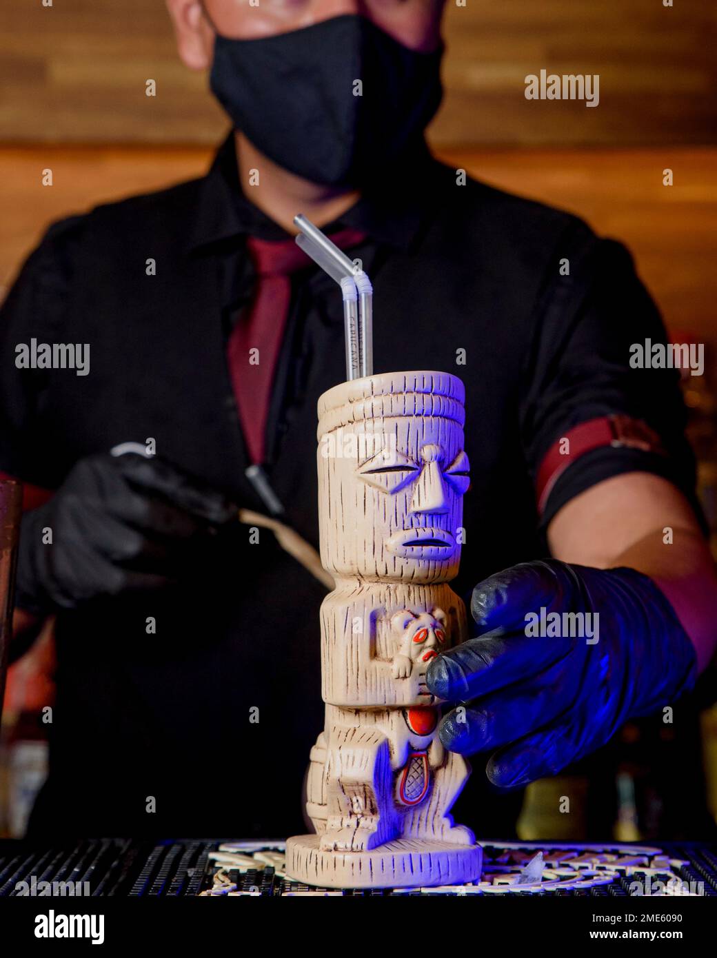 bartender with mask preparing cocktail at a bar counter Stock Photo - Alamy
