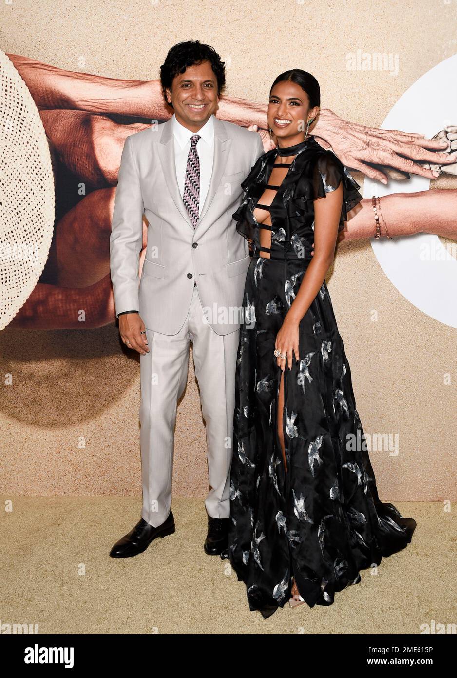 Director M. Night Shyamalan, left, poses with his daughter and second ...