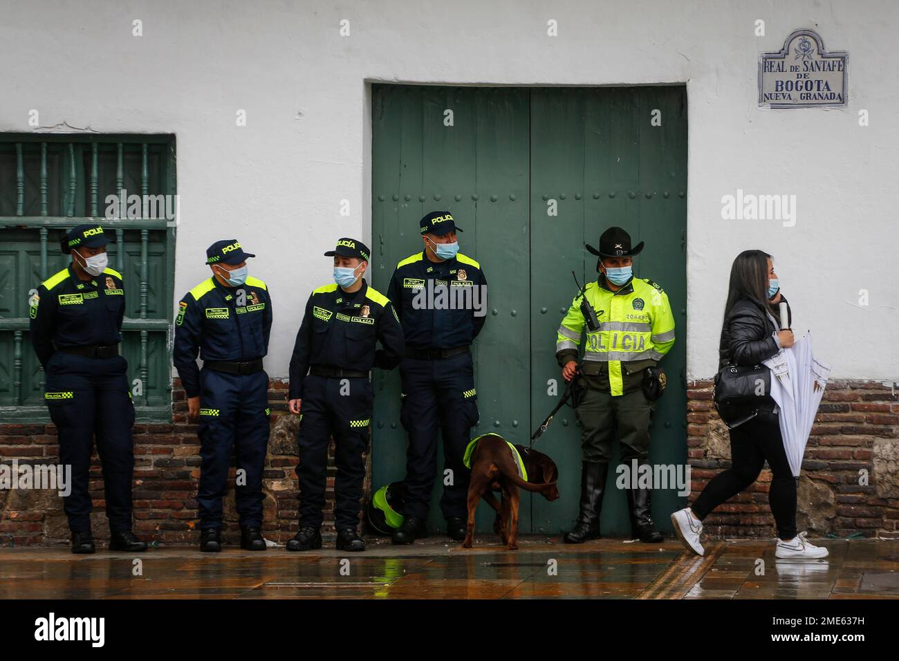 National Police wearing the force's new, blue uniforms stand by an ...