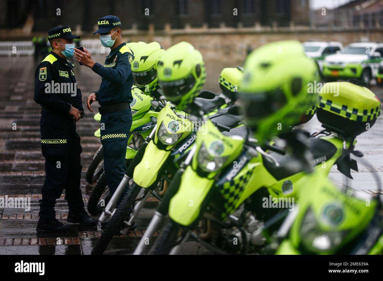 National Police take photos during a ceremony launching their new ...