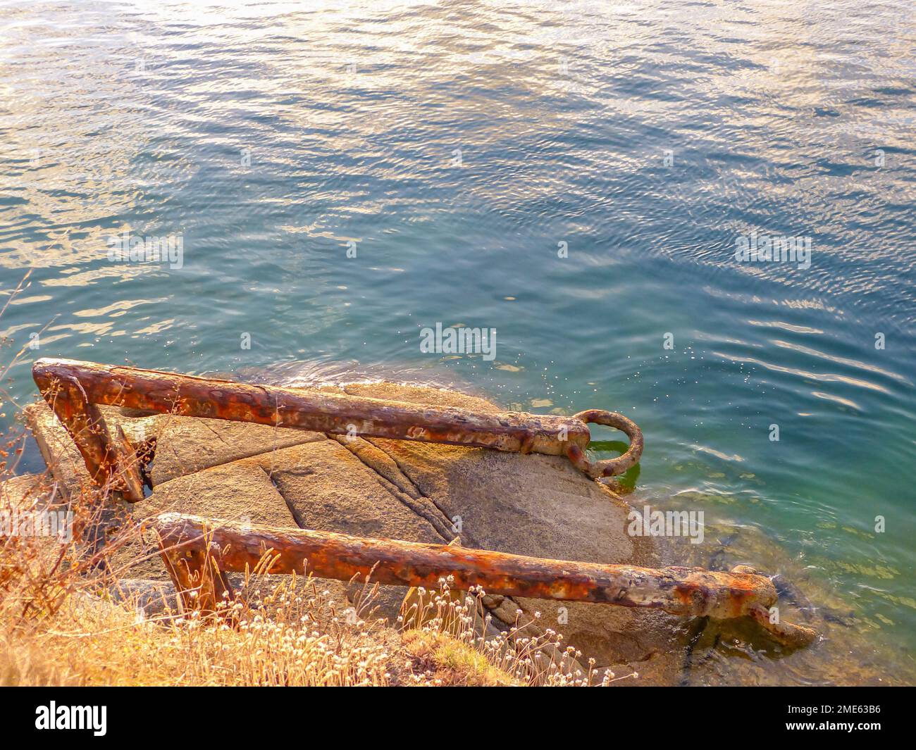 Two very old anchors stuck in the rock totally rusty on the Spanish ...