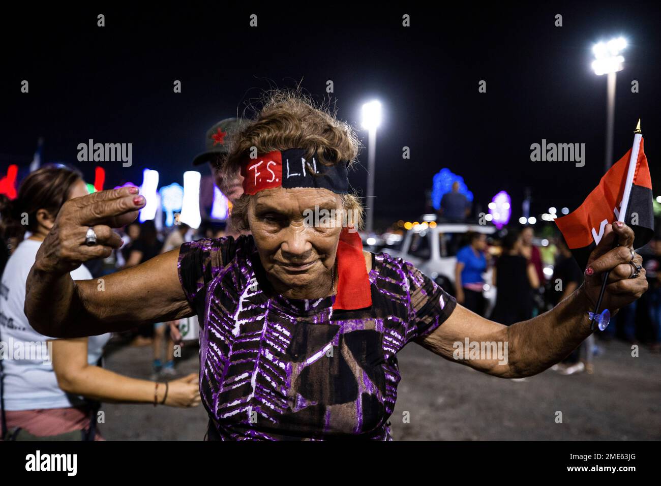 A woman wears a Sandinista National Liberation Front (FSLN) headband ...