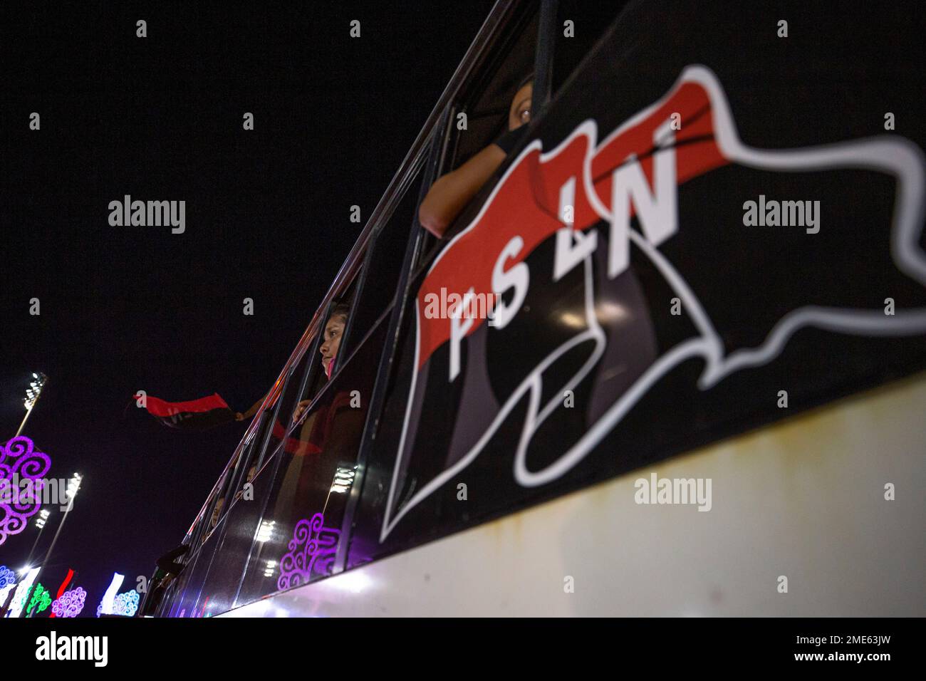 Sandinista supporters travel to Juan Pablo II Square in a public bus ...