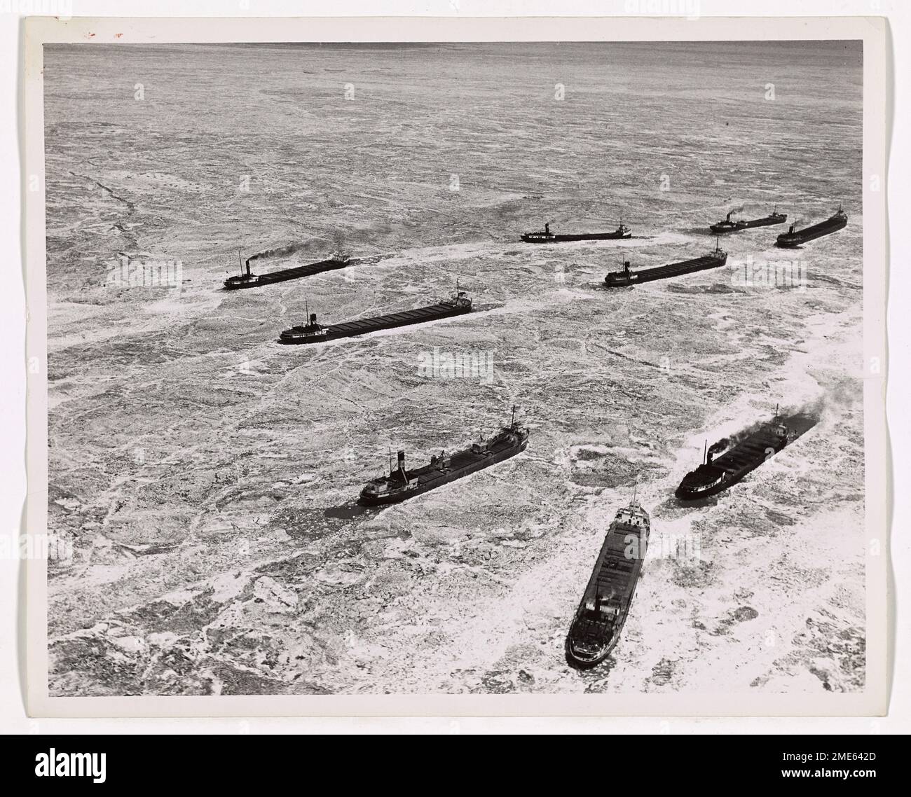 The image shows nine steamers navigating through icy waters, showcasing ...