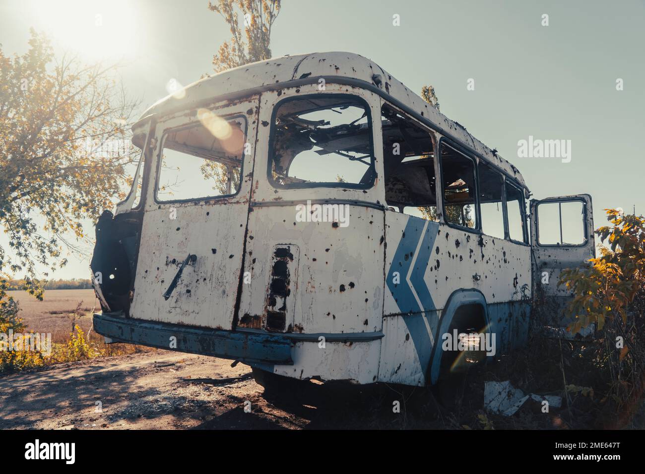 Countryside. Bus damaged by shelling. War in Ukraine. Russian invasion ...