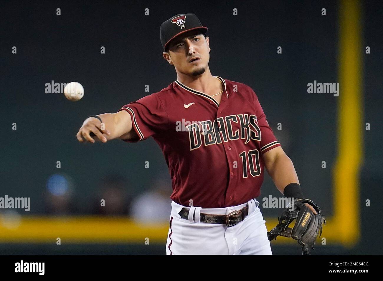 Arizona Diamondbacks second baseman Josh Rojas warms up as he throws to ...