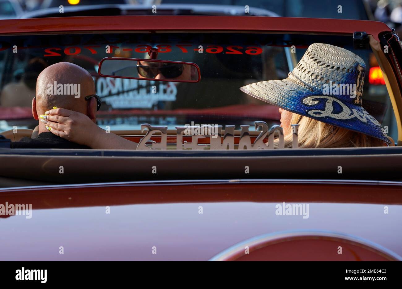 A couple cruises in a convertible Lowrider vehicle on Sunset Blvd., in ...